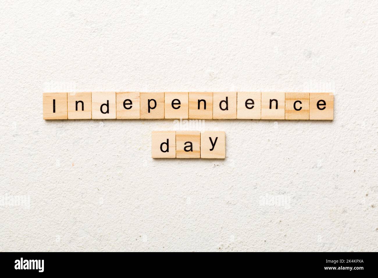 Independence Day word written on wood block. Independence Day text on ...