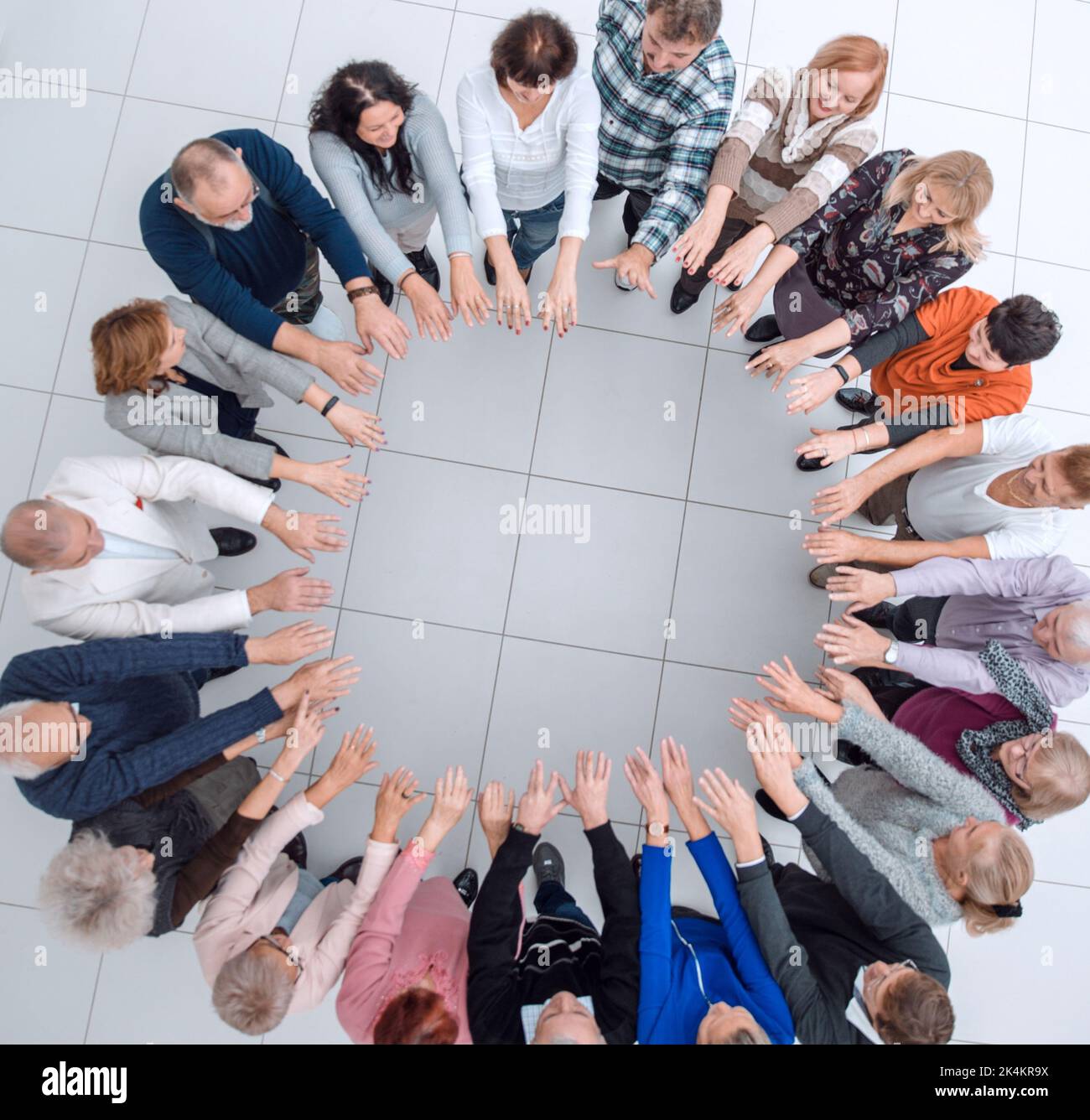 group of mature people showing their unity Stock Photo - Alamy