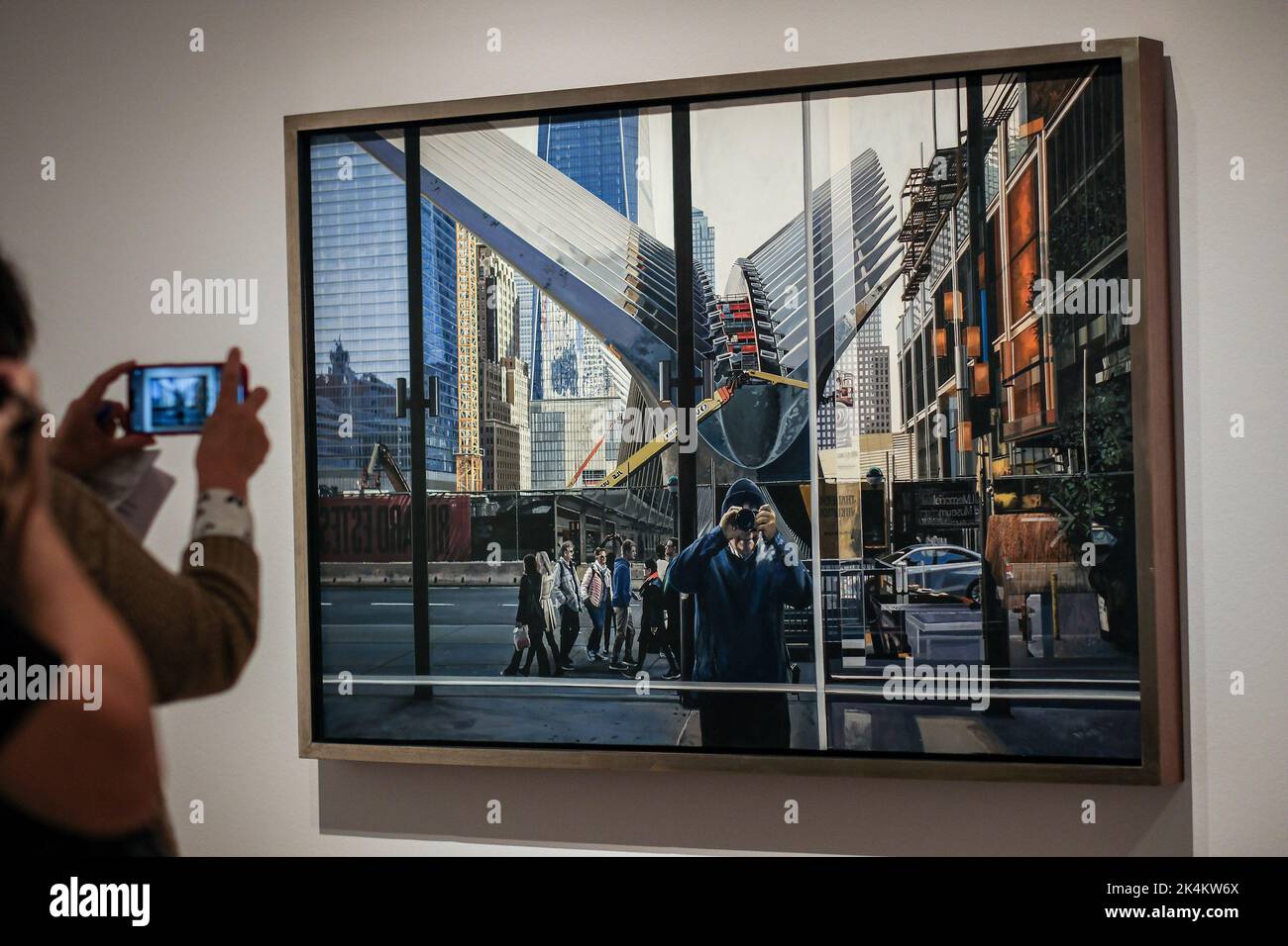 A visitor takes a picture of the painting of the author Richard Estes ...