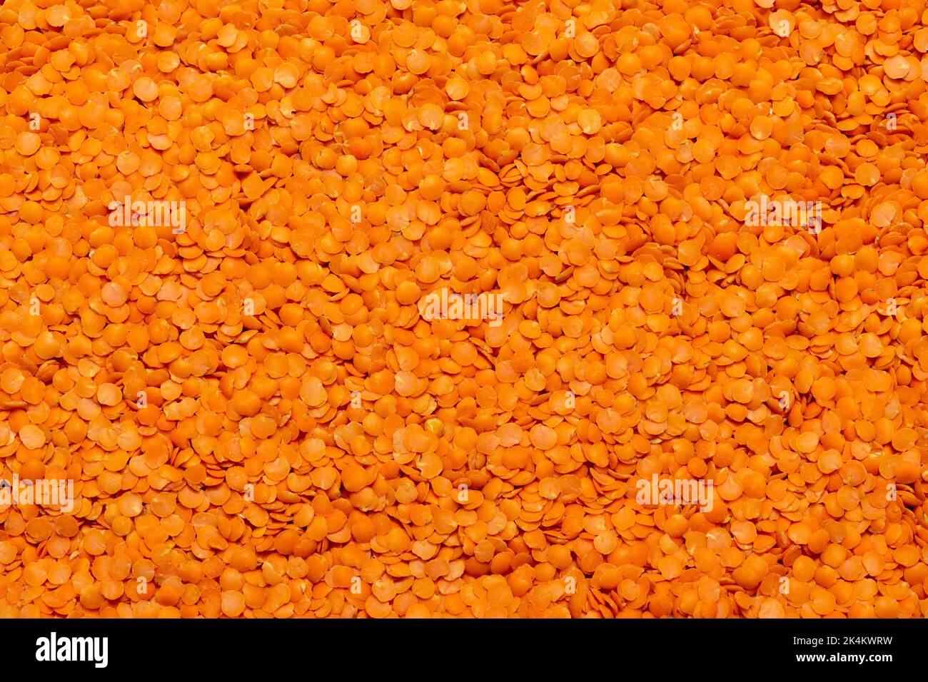 Yellow lentil background texture Stock Photo - Alamy