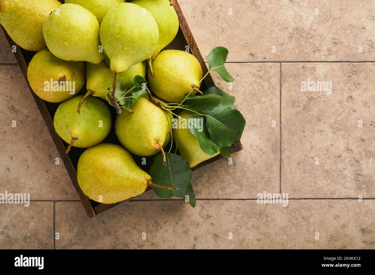 Pears. Fresh sweet organic pears with leaves in wooden box or basket on ...