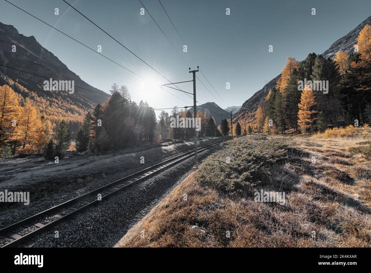 Alpine valley railway in the Swiss Alps in autumn Stock Photo - Alamy