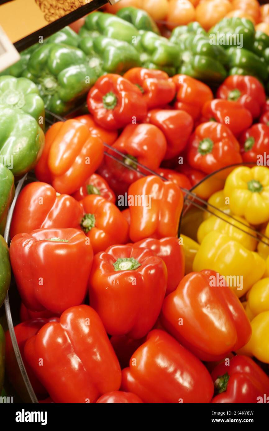 Yellow orange and red capsicum on white background Stock Photo - Alamy