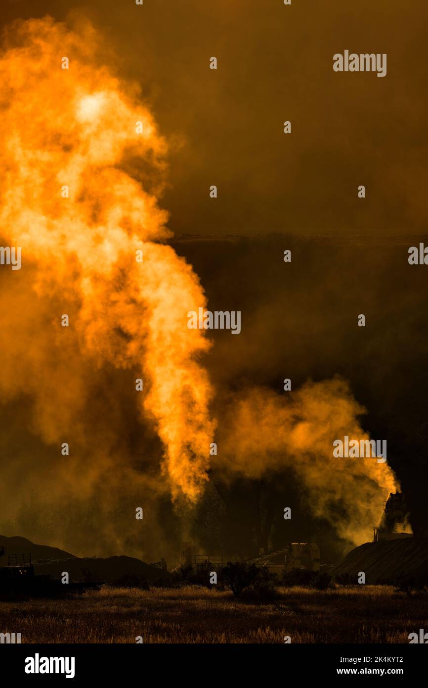 Smoke or steam rising into the air environment pollution emissions ...