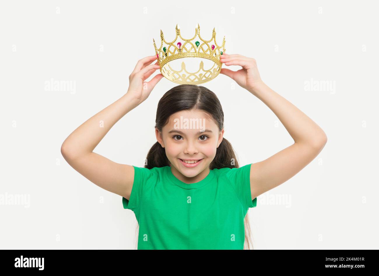 Behaving like princess is work. Kid wear golden crown symbol of ...