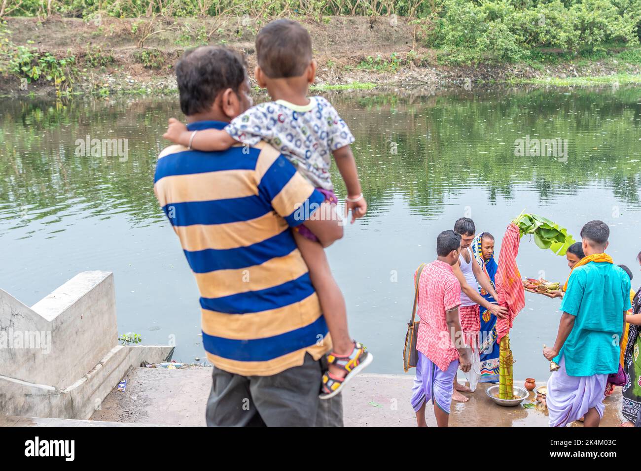 One of the first rituals of durga puja is the "Kola Bou Snan". She is ...