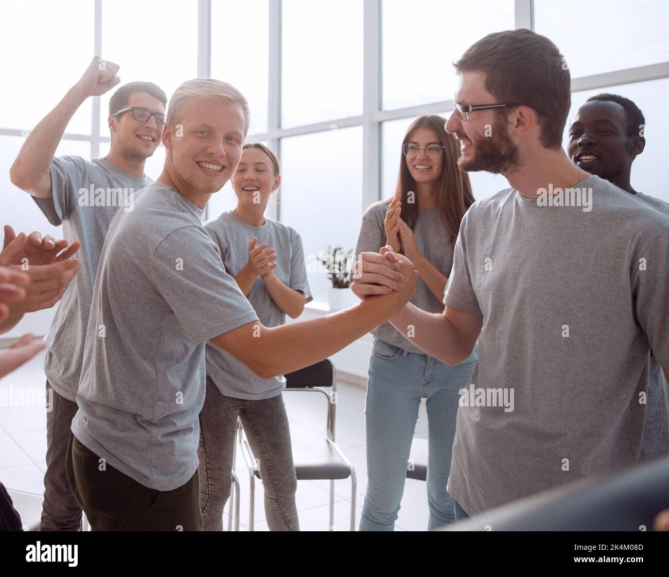 two leaders standing in the circle of the contact group Stock Photo - Alamy