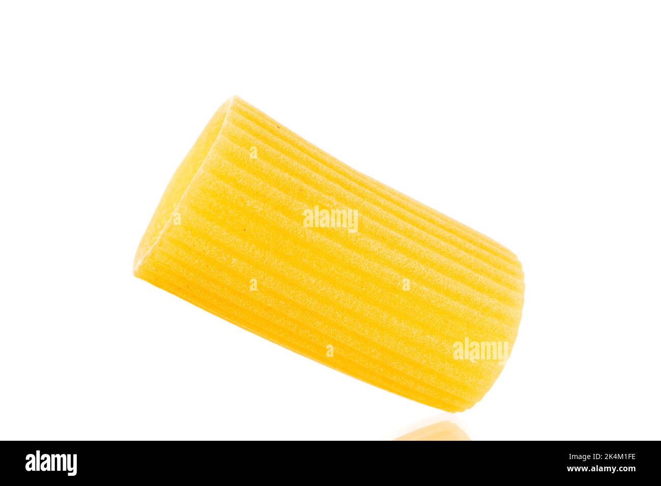 One raw yellow cannelloni, macro, isolated on white background Stock ...