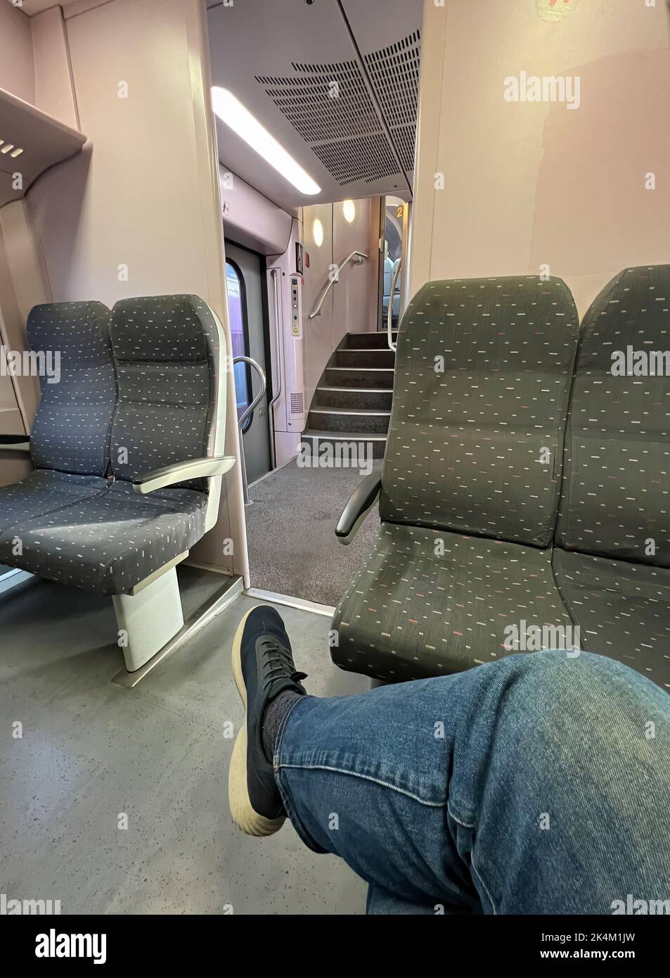 Vertical view on a commuting modern Belgian railway train wagon with ...