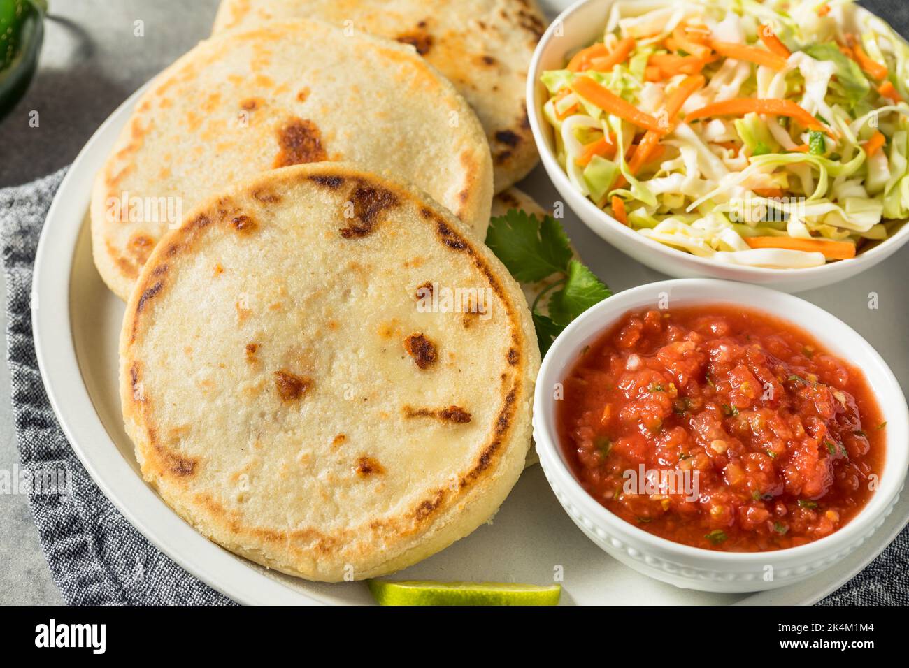 Homemade Salvadoran Corn Pupusas with Curtido and Salsa Stock Photo - Alamy