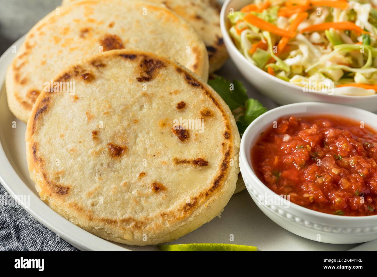Homemade Salvadoran Corn Pupusas with Curtido and Salsa Stock Photo - Alamy