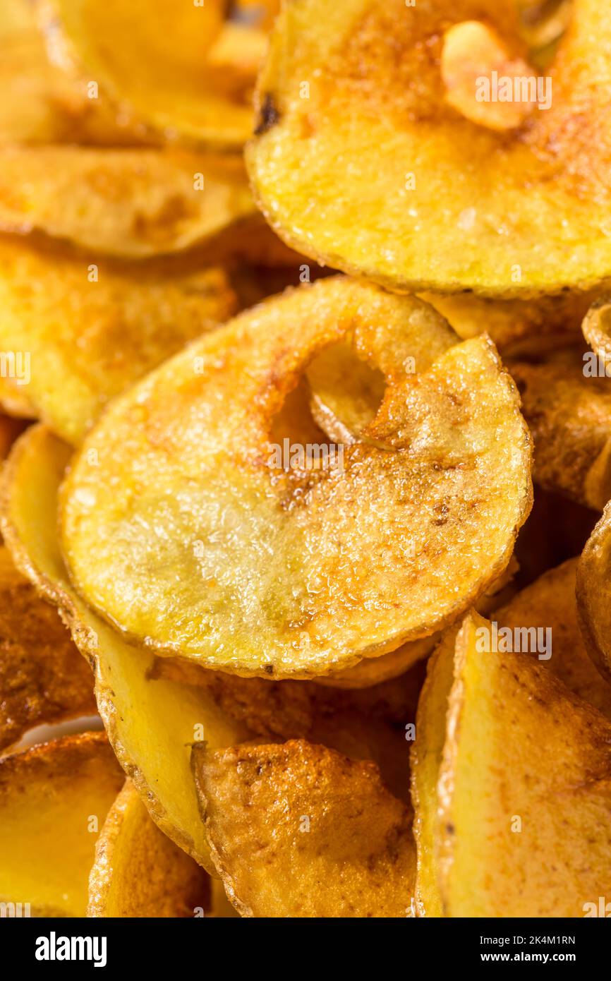 Homemade Spiral Cut Potato Chips with Salt and Ketchup Stock Photo - Alamy