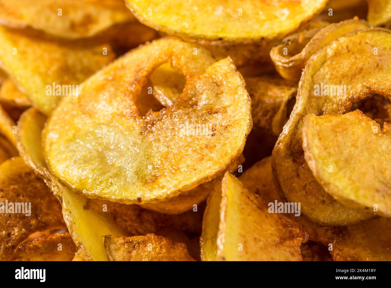 Homemade Spiral Cut Potato Chips with Salt and Ketchup Stock Photo - Alamy