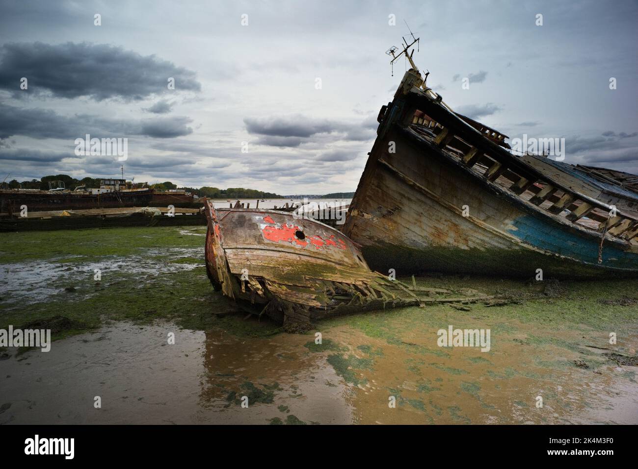 Rotting sailing boats on the mud at low tide in Pin Mill, Suffolk Stock ...