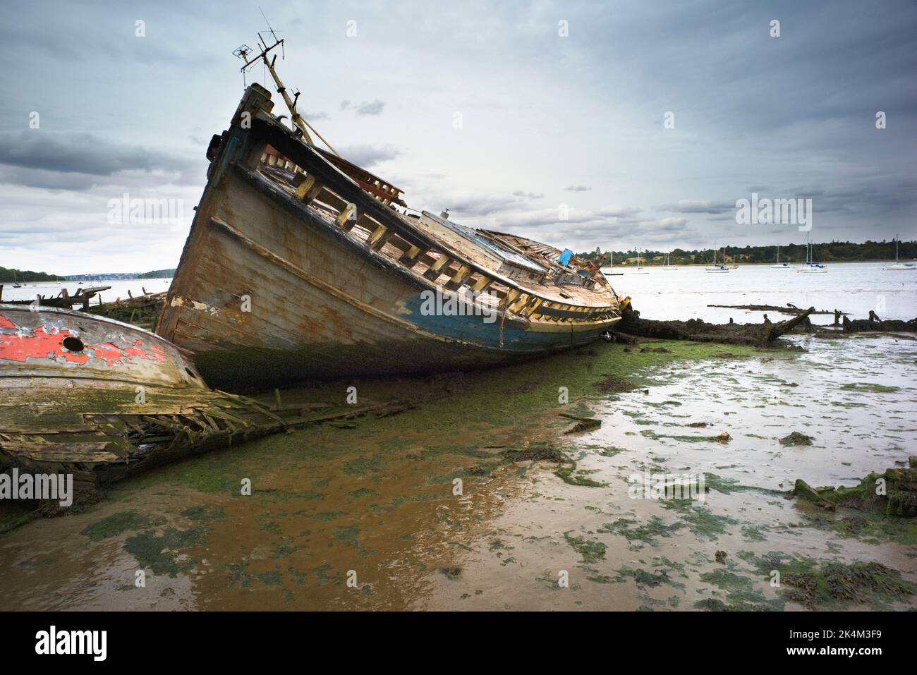 Rotting sailing boats on the mud at low tide in Pin Mill, Suffolk Stock ...