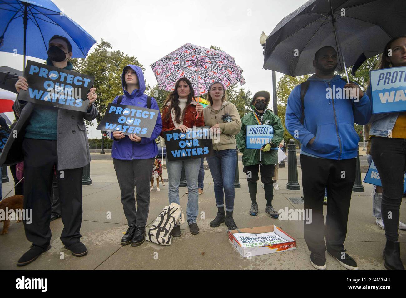 Washington, United States. 03rd Oct, 2022. Activists stand in the rain ...