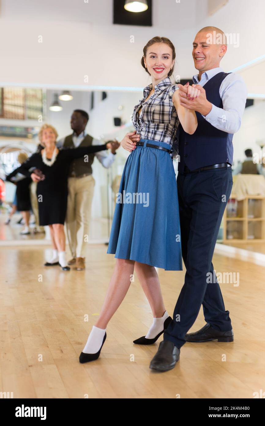 Man and woman performing ballroom dance in dancing room Stock Photo - Alamy