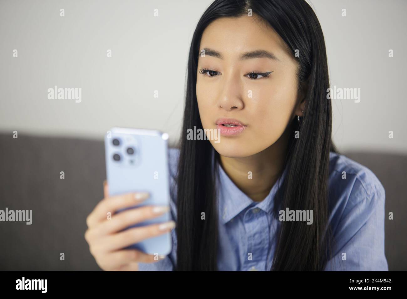 Beautiful asian girl talking on frontal camera during video call. Cute ...