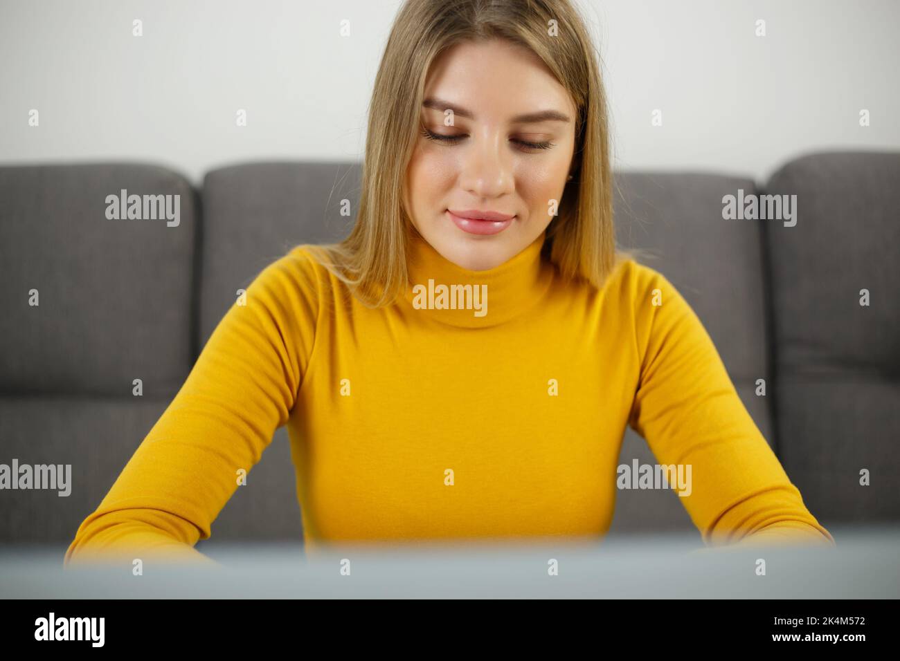 Beautiful woman working on laptop. Portrait of attractive white female ...