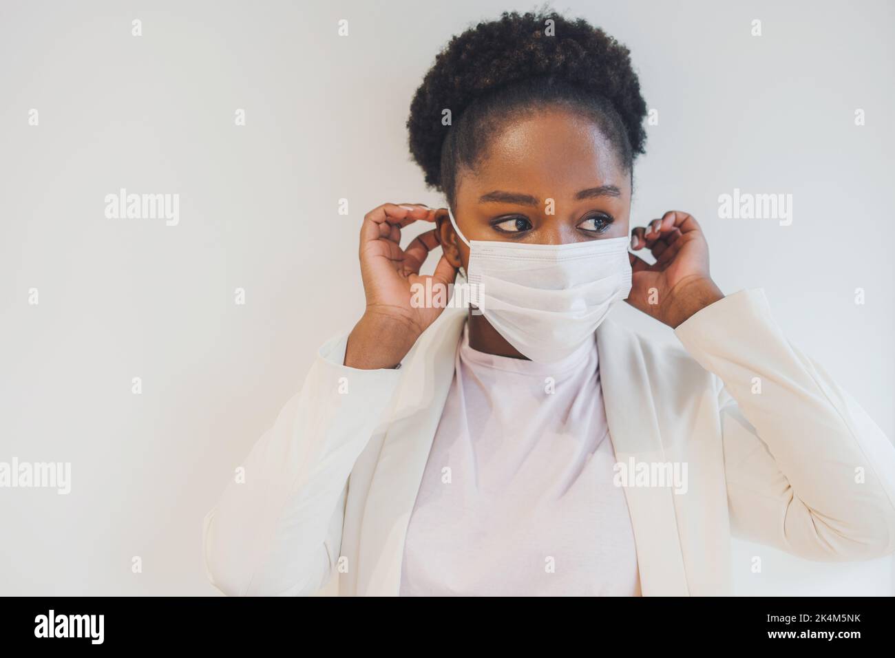 Portrait of black businesswoman with Afro hairstyle looking forward ...