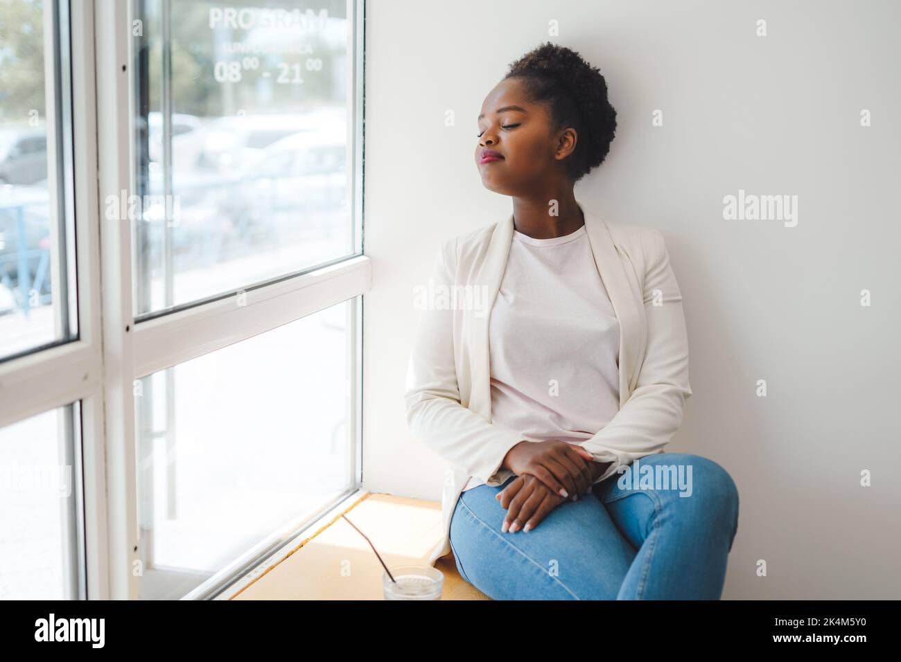 African-american young woman waiting someone who late, in coffee shop ...