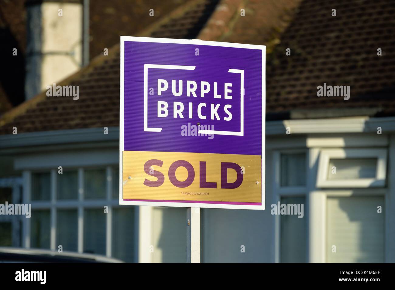 A 'Purple Bricks' online estate agents 'Sold' sign outside a suburban ...