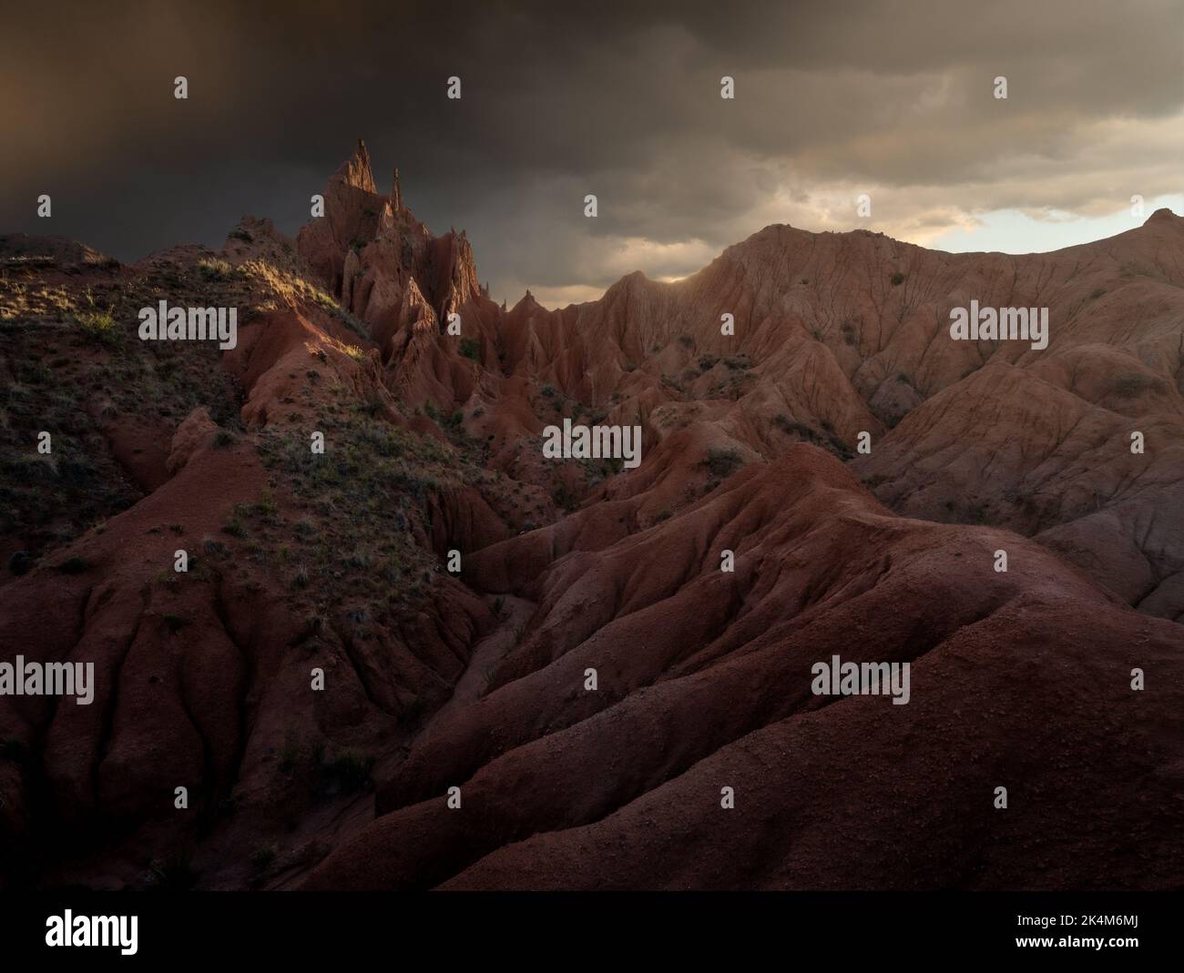 Sharp rock formations and dramatic sunset at colourful Skazka Fairytale ...