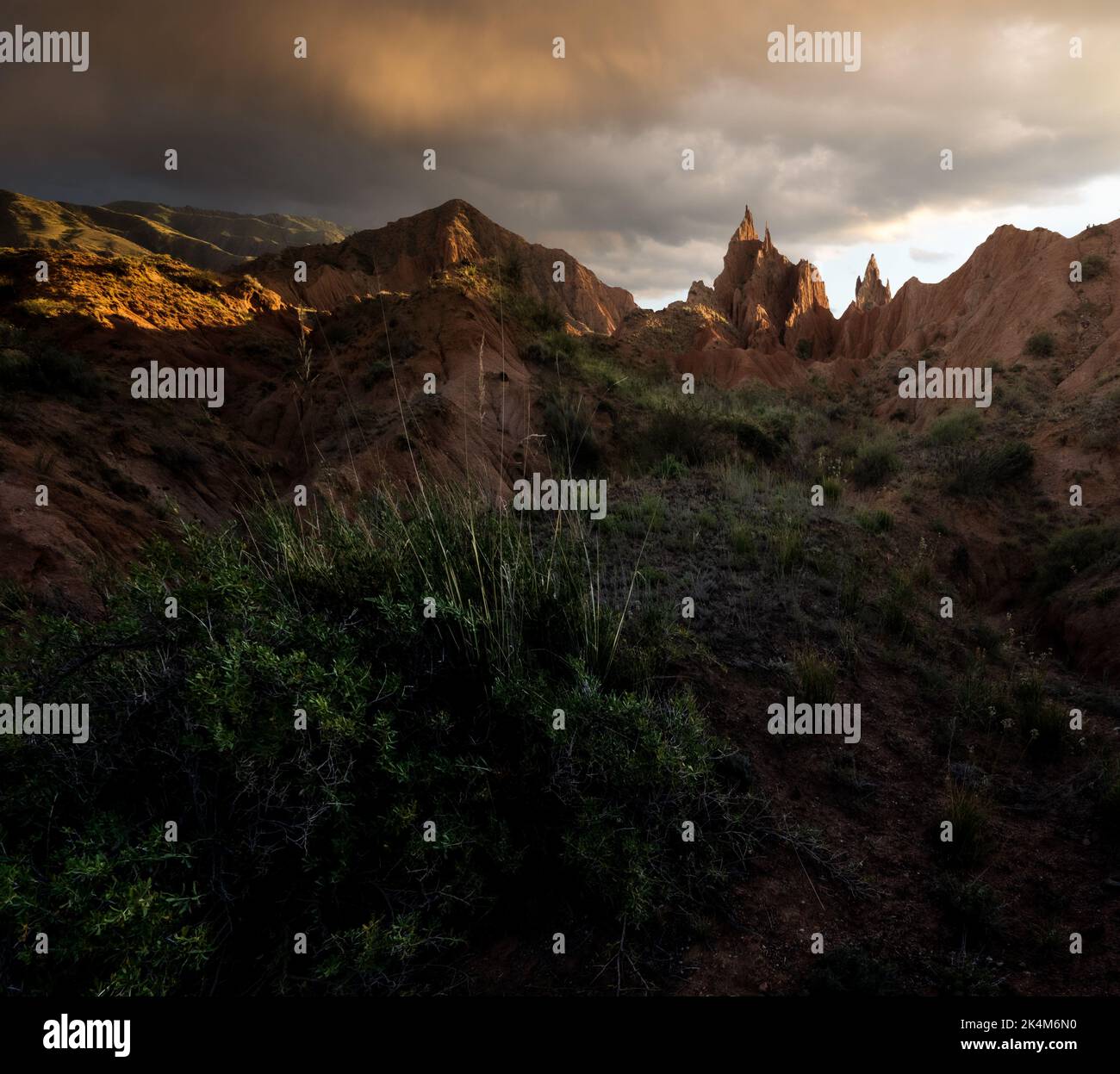 Dramatic sunset at colourful Skazka Fairytale Canyon in Issyk-Kul ...