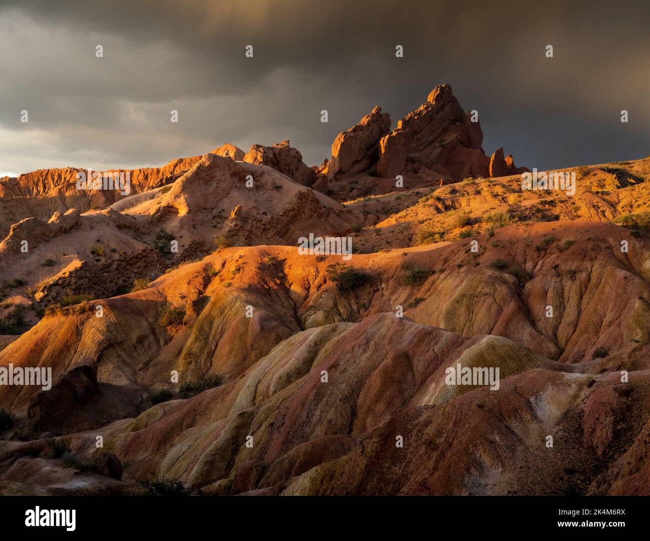 Sharp rock formations and dramatic sunset at colourful Skazka Fairytale ...