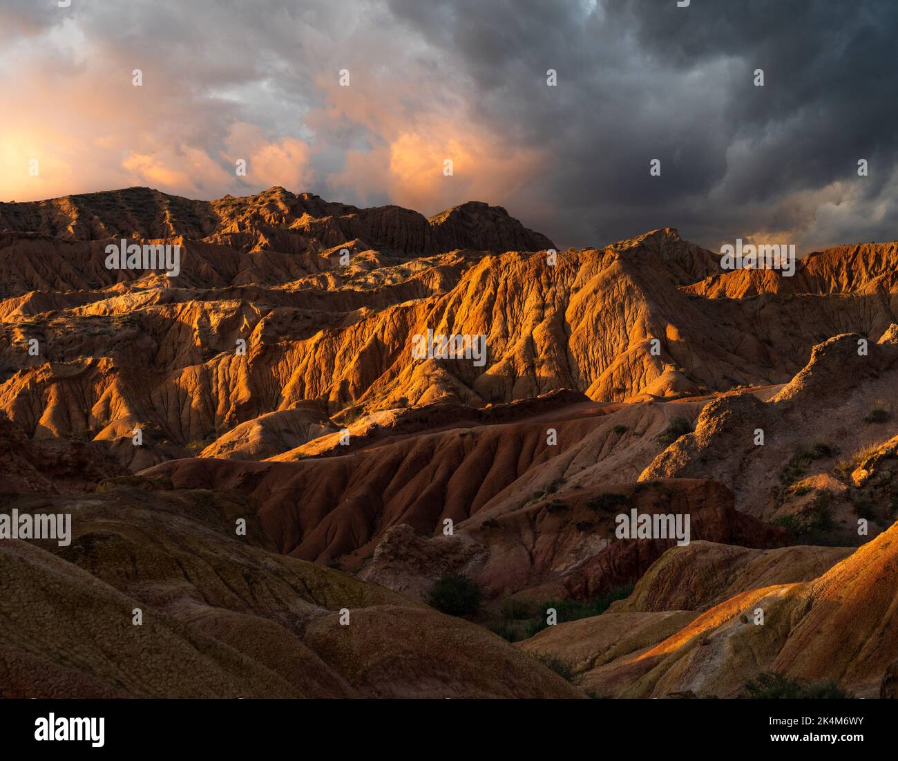 Dramatic sunset at colourful Skazka Fairytale Canyon in Issyk-Kul ...