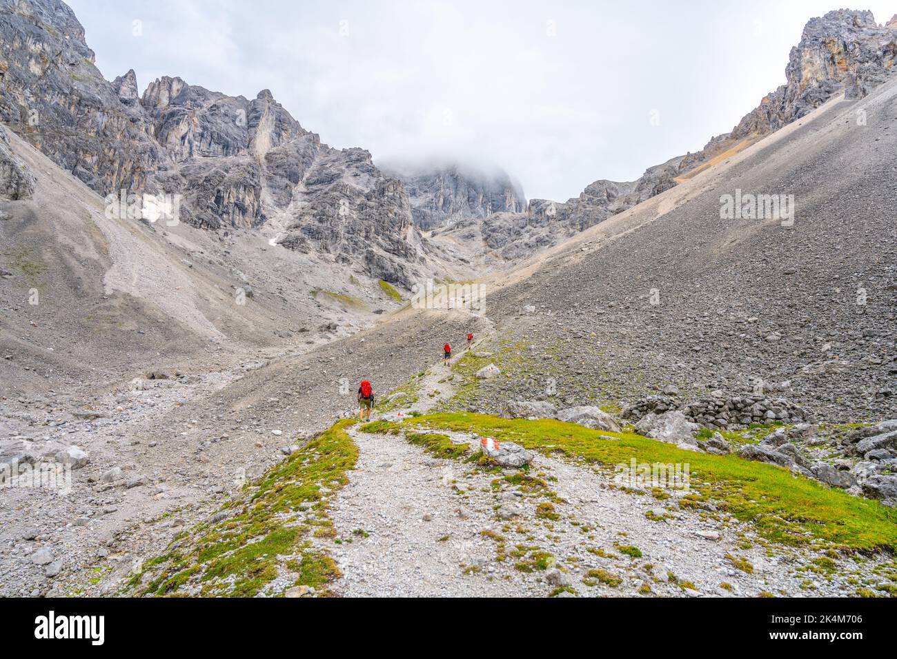 Three men climbing mountain hi-res stock photography and images - Alamy