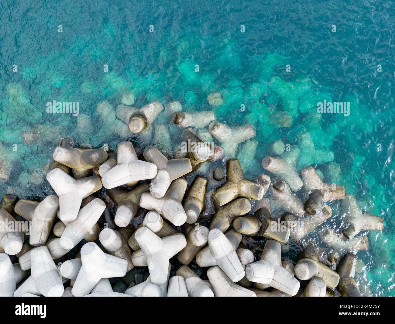 Aerial Drone View of a Concrete Breakwater. Breakwater in the Sea. Blue ...