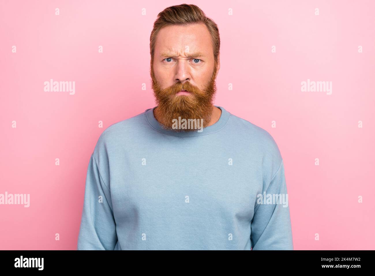 Portrait photo of young bearded redhair handsome man unhappy angry ...
