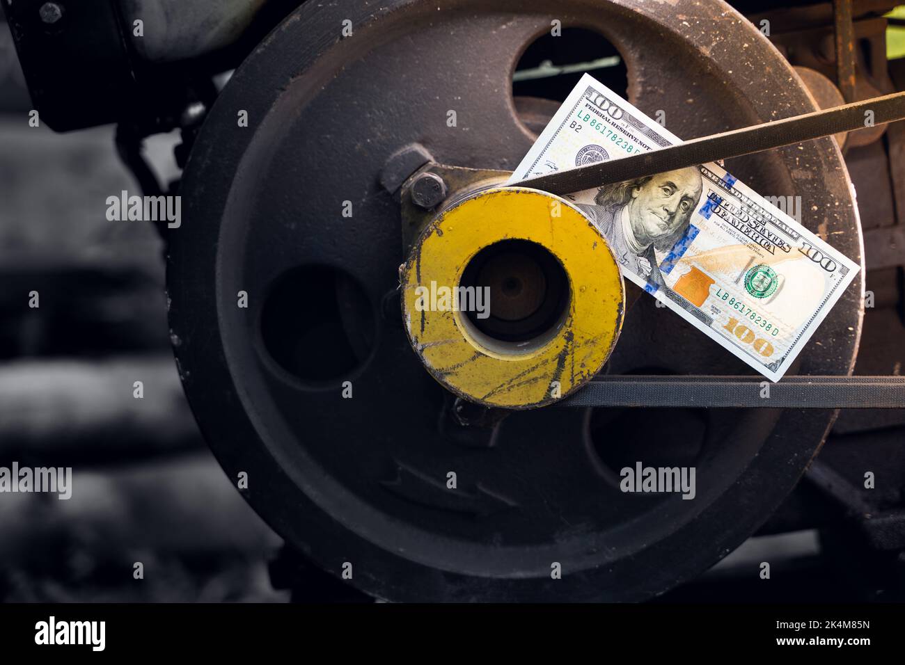 Hundred dollar bill close-up on an industrial background. Money on a ...
