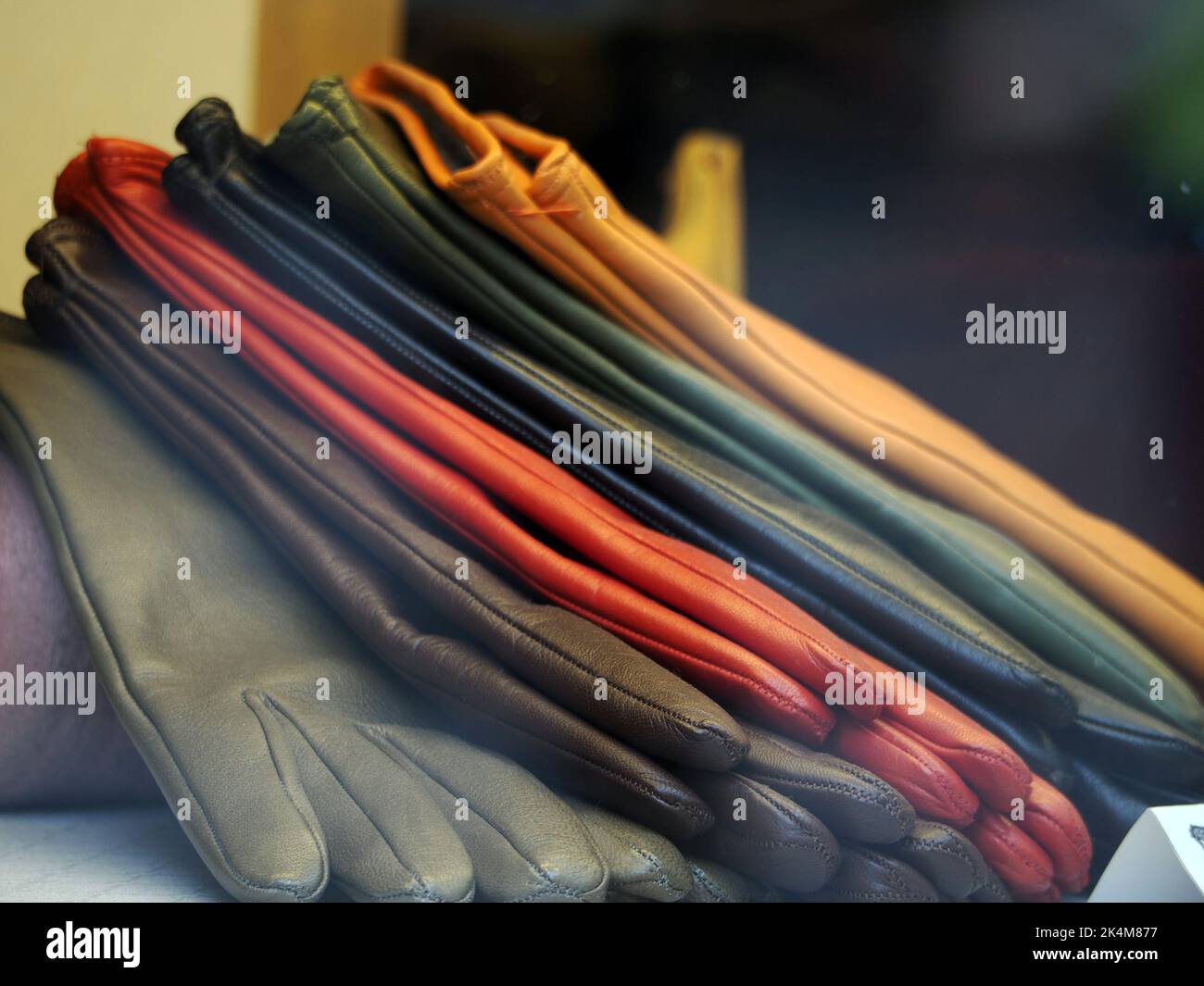 many different colors leather gloves on display Stock Photo - Alamy
