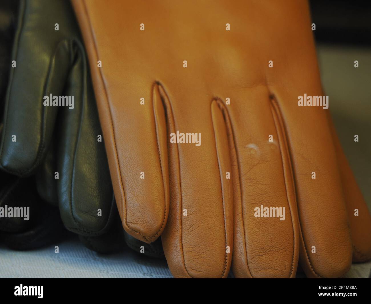 many different colors leather gloves on display Stock Photo - Alamy