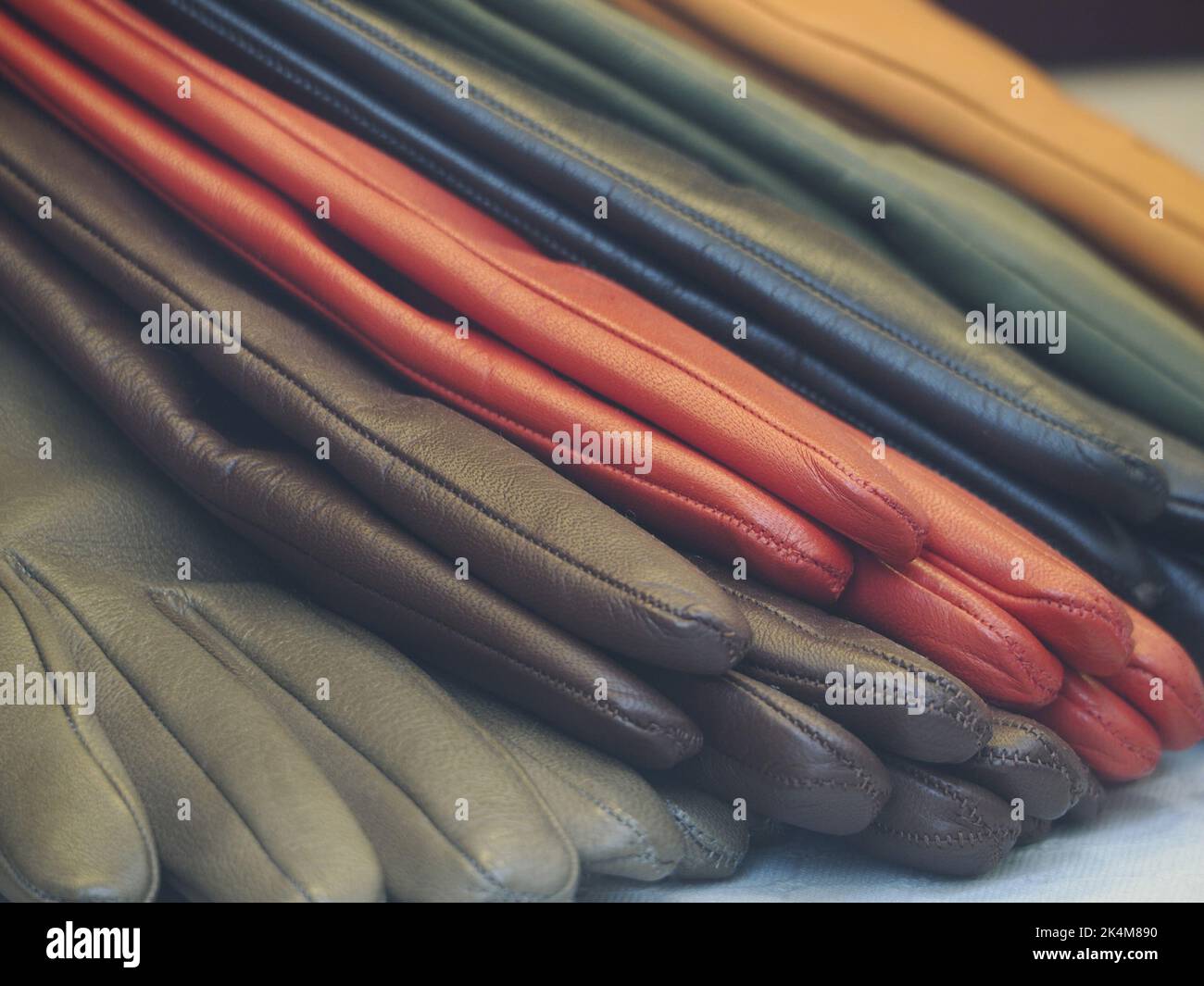 many different colors leather gloves on display Stock Photo - Alamy