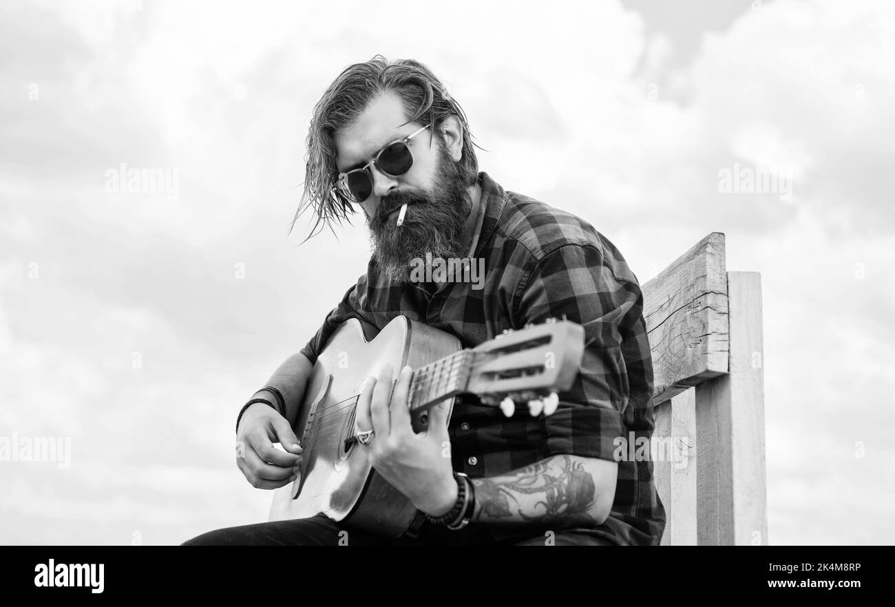 music concept. brutal handsome man with moustache play guitar. mature ...