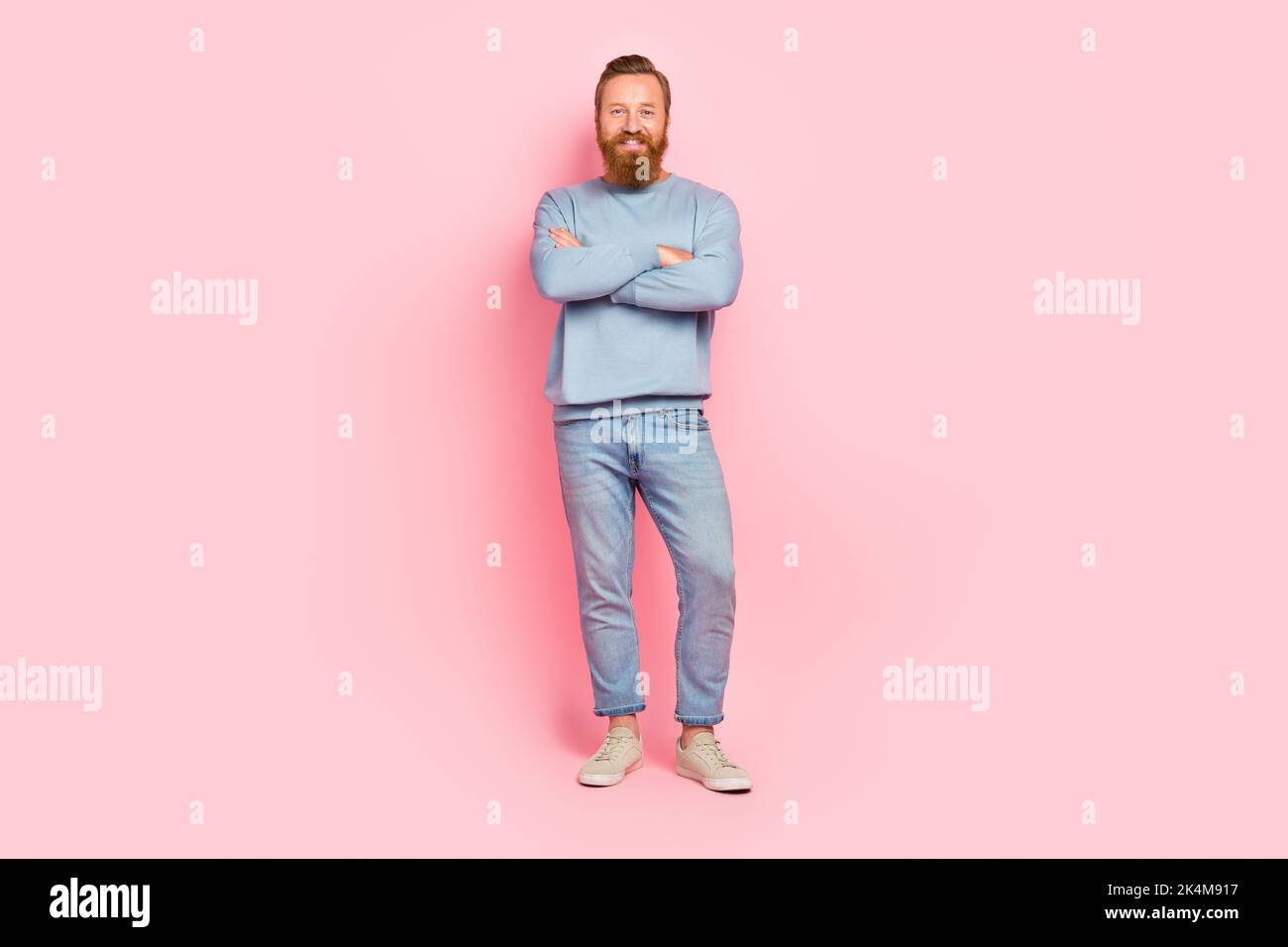 Full size portrait of satisfied glad young man crossed arms toothy ...