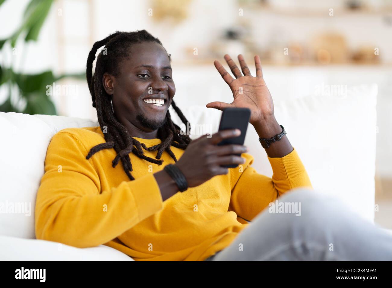 Distant Communication. Smiling Black Guy Making Video Call Via ...