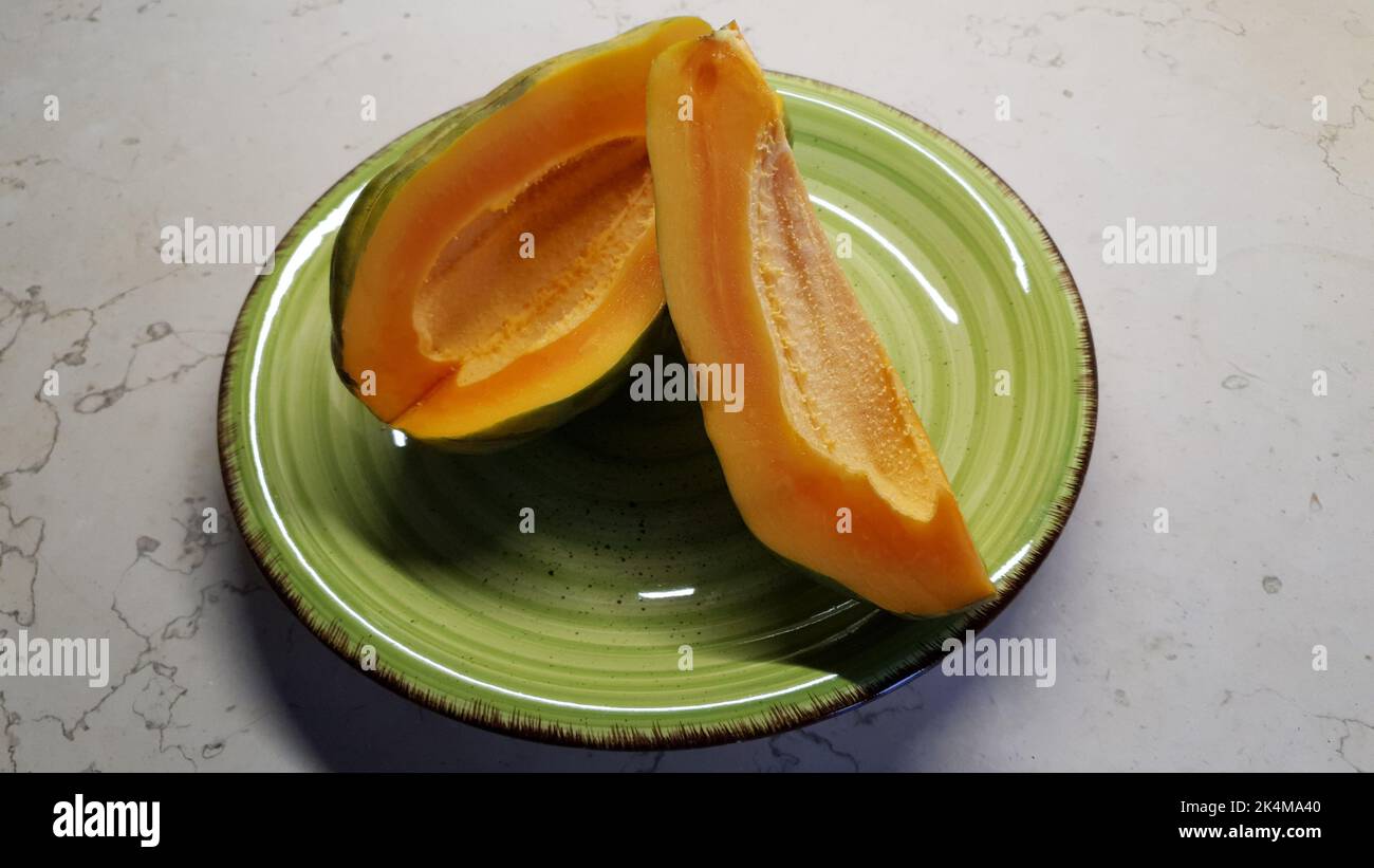 papaya a succulent tropical fruit Stock Photo - Alamy