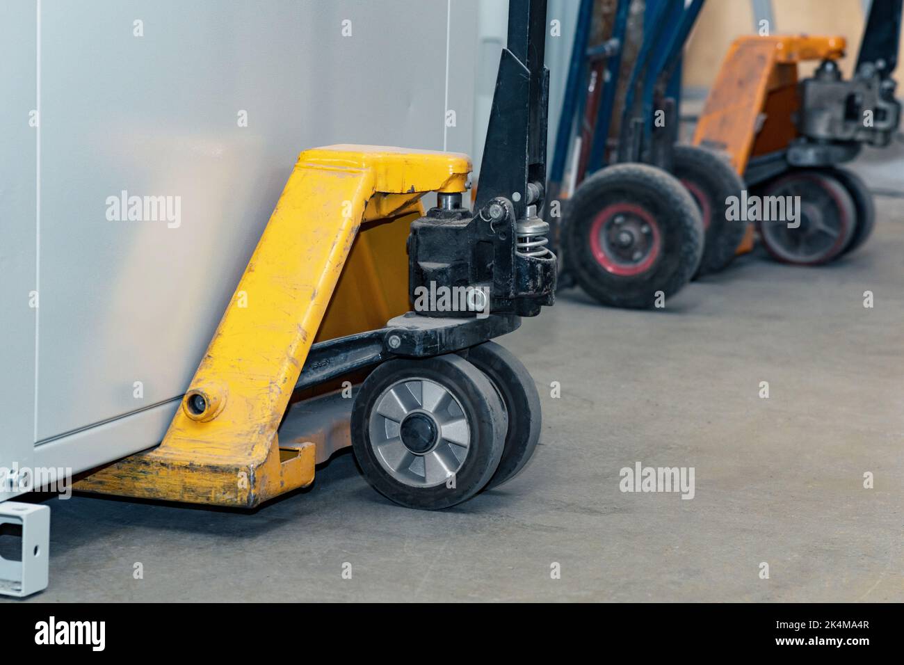 hydraulic jacks for storage pallets close-up Stock Photo - Alamy