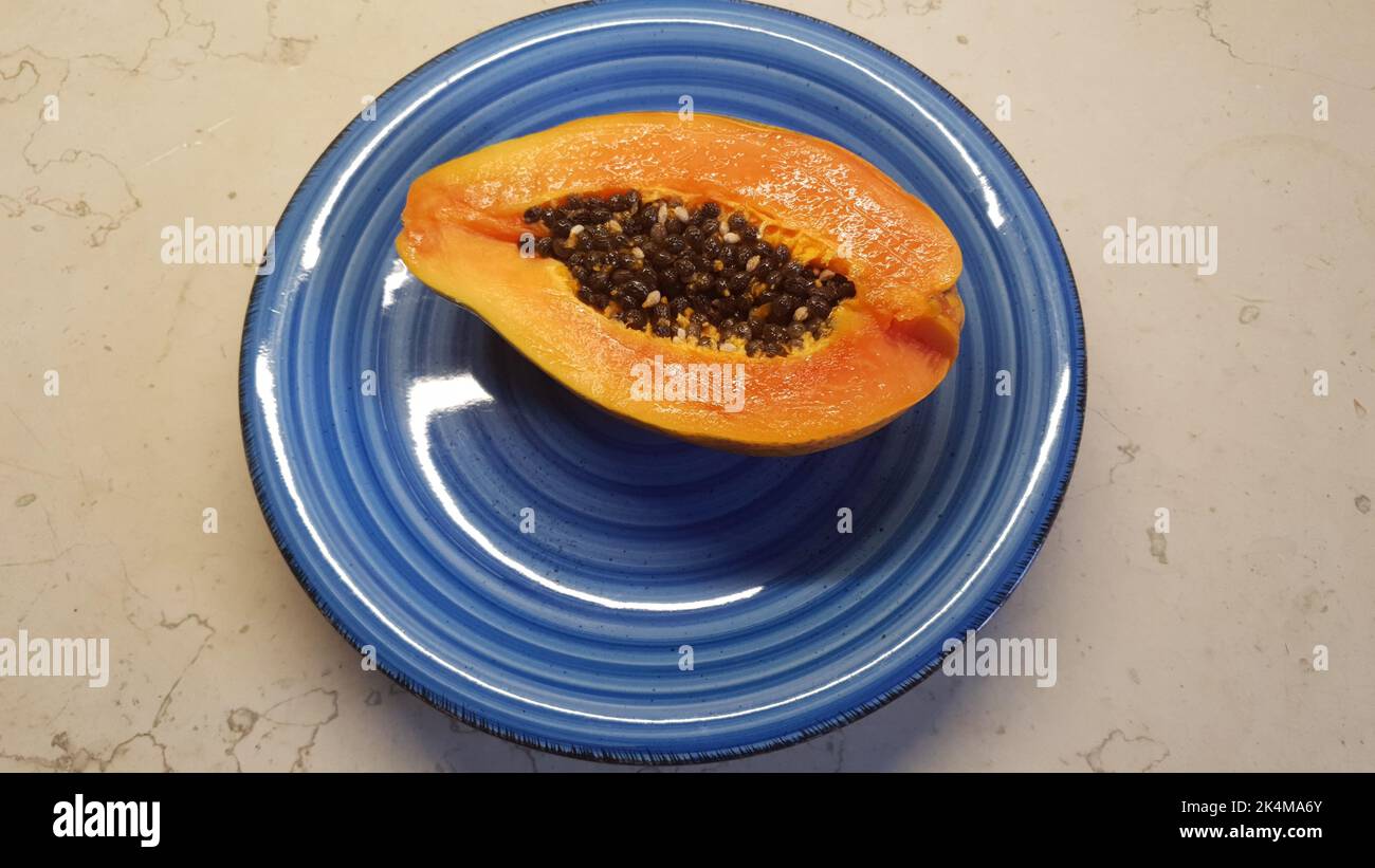 papaya a succulent tropical fruit Stock Photo - Alamy