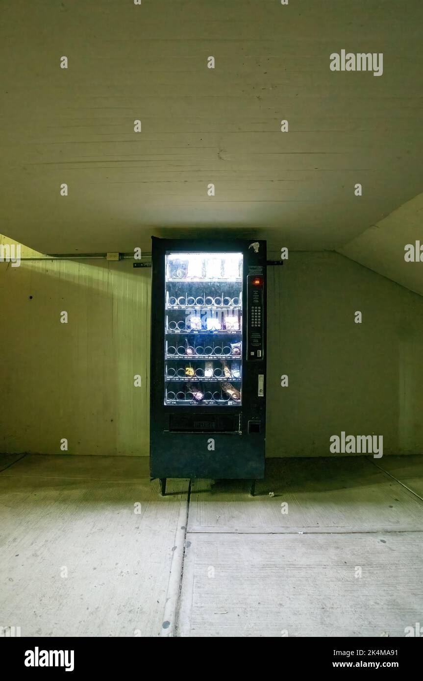 vending machine, with interior light, wall, ceiling and concrete floor ...