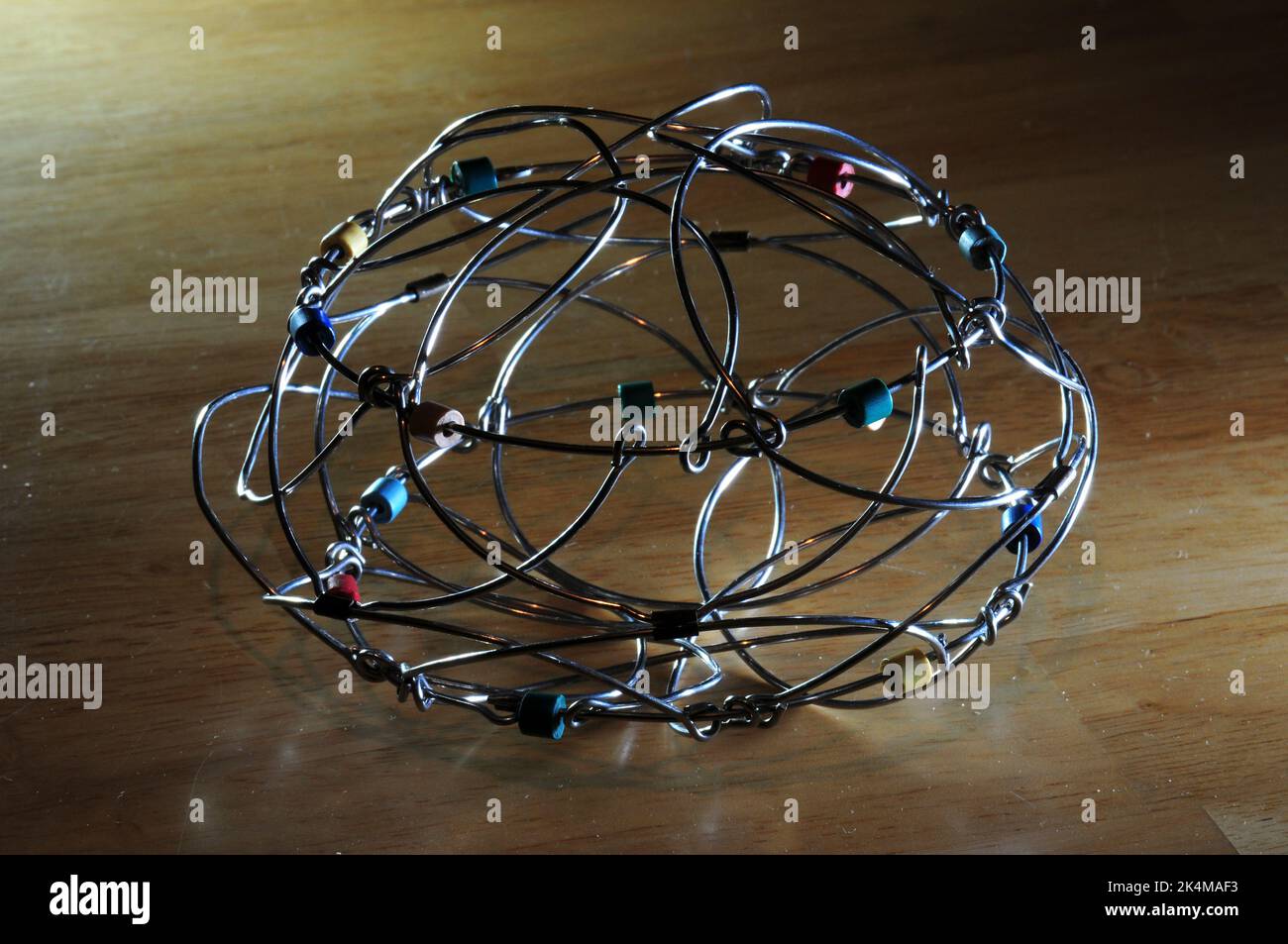 Contractable and bendable child's wire toy Stock Photo - Alamy