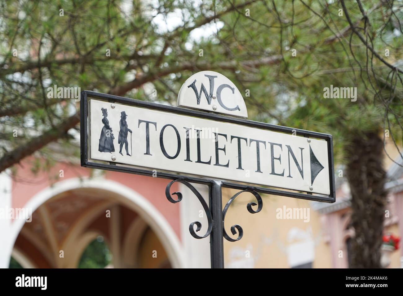 A public toilet sign on the street Stock Photo - Alamy