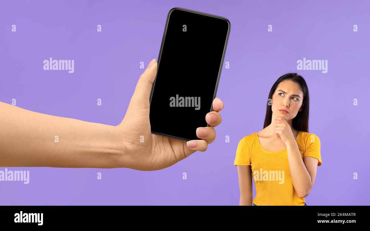 Pensive millennial european lady think at choice, look at huge ...