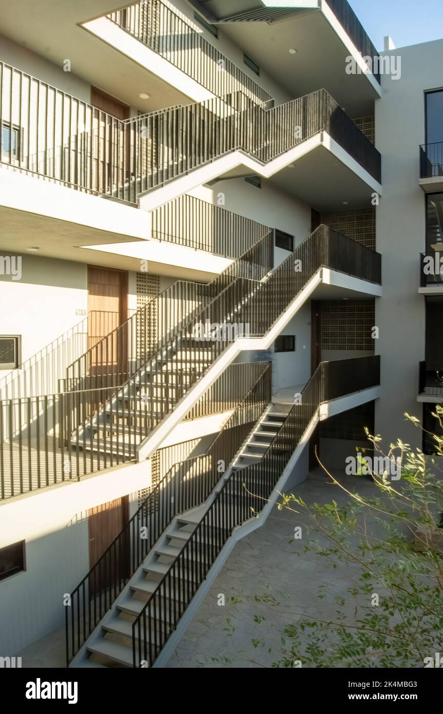 stairs apartment building, white building income wooden doors, central ...