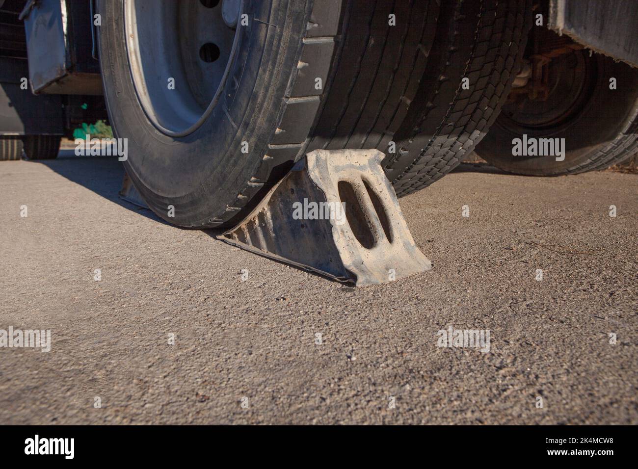Full metal wheel chock under trailer. Ground view Stock Photo - Alamy Full metal wheel chock under trailer. Ground view Stock Photo - Alamy