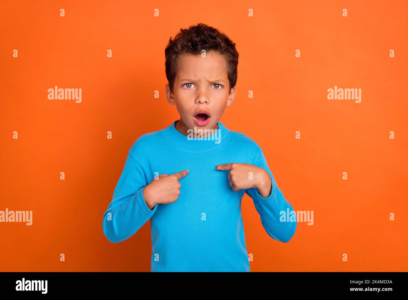 Photo of astonished dissatisfied boy hand arm direct himself ...